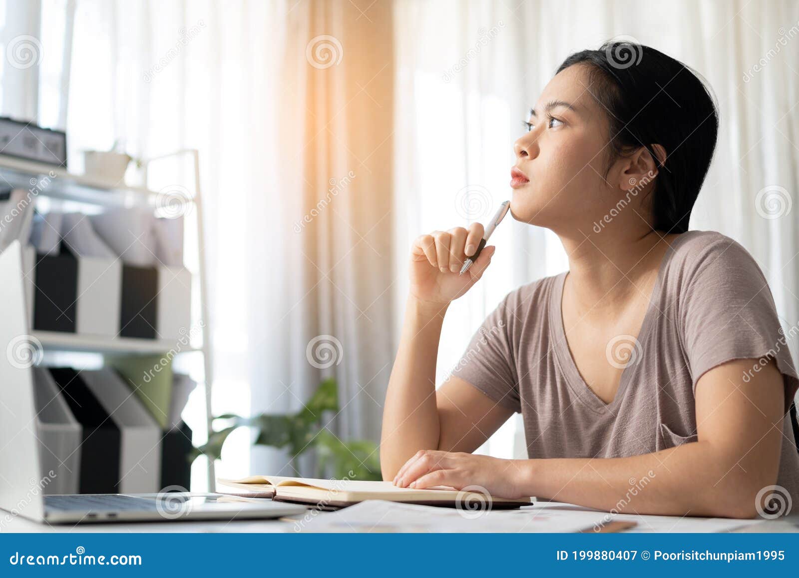 Women is Thinking while Writing Note with Laptop Stock Image - Image of ...