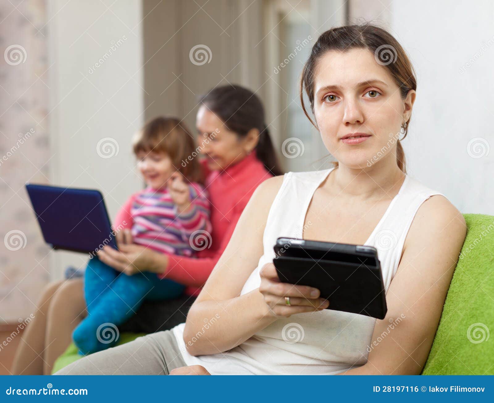 Women of Three Generations with Electronic Devices Stock Photo - Image ...
