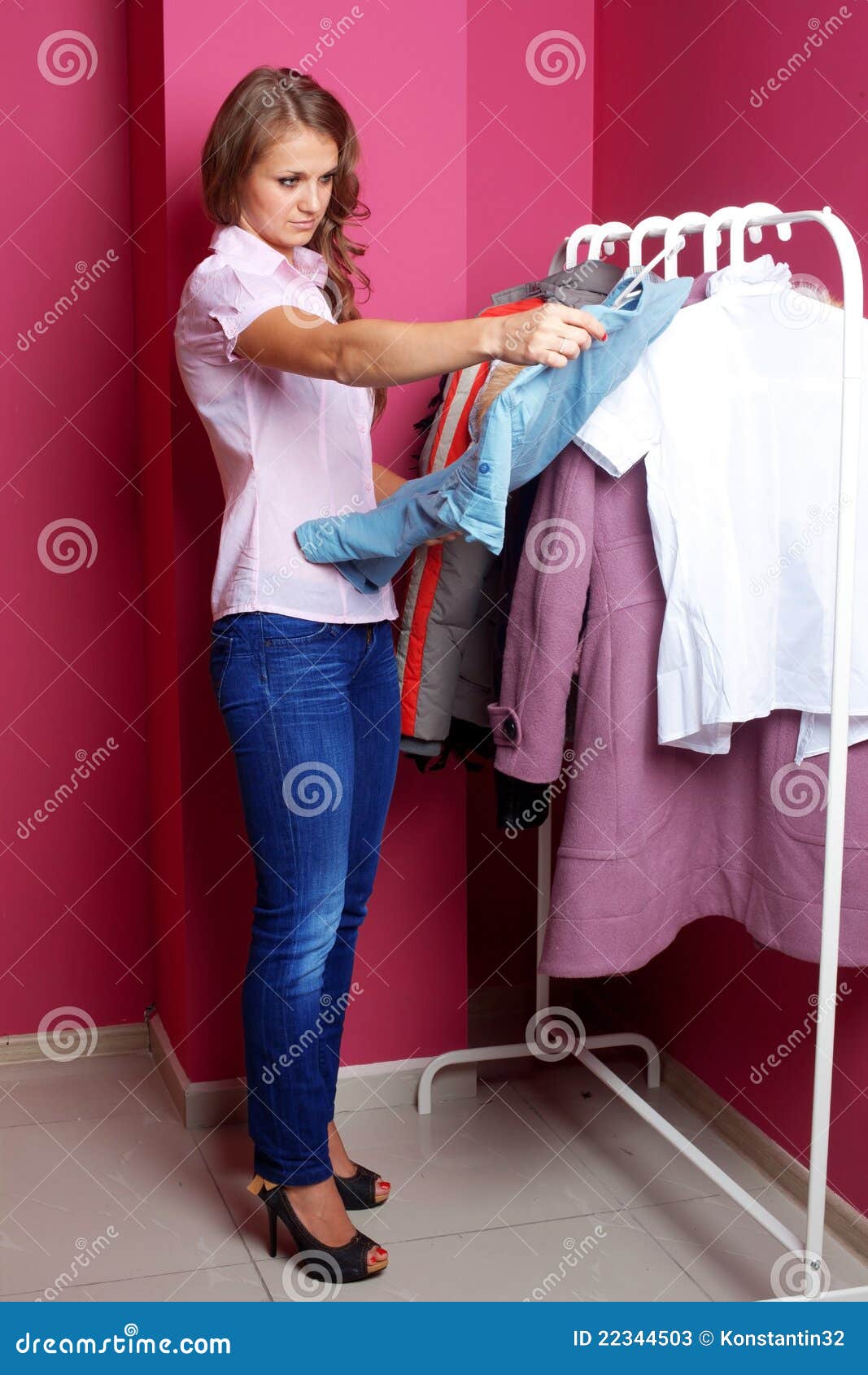 Women trying on clothes stock image. Image of attractive - 22344503