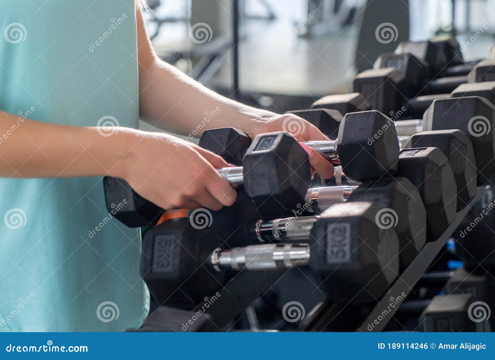 Women Using Dumbbell in Gym Stock Photo - Image of dark, girl: 189114246