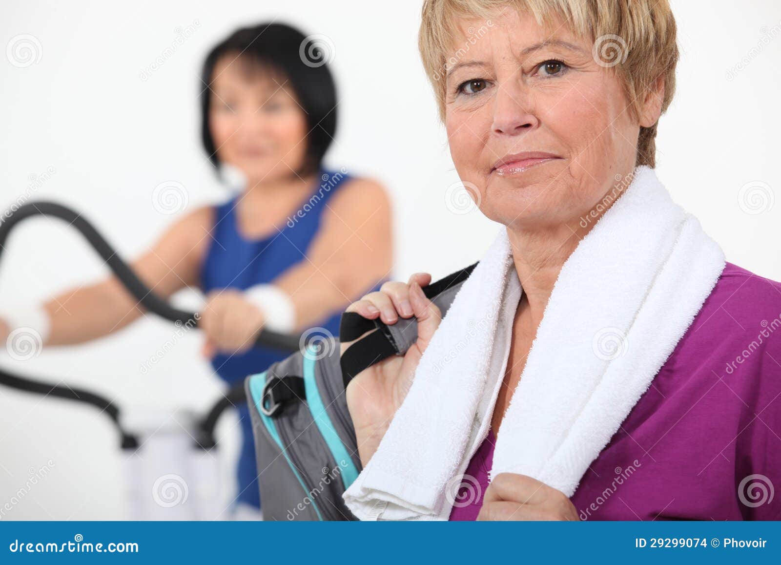 Women using gym equipment stock photo. Image of midlife - 29299074