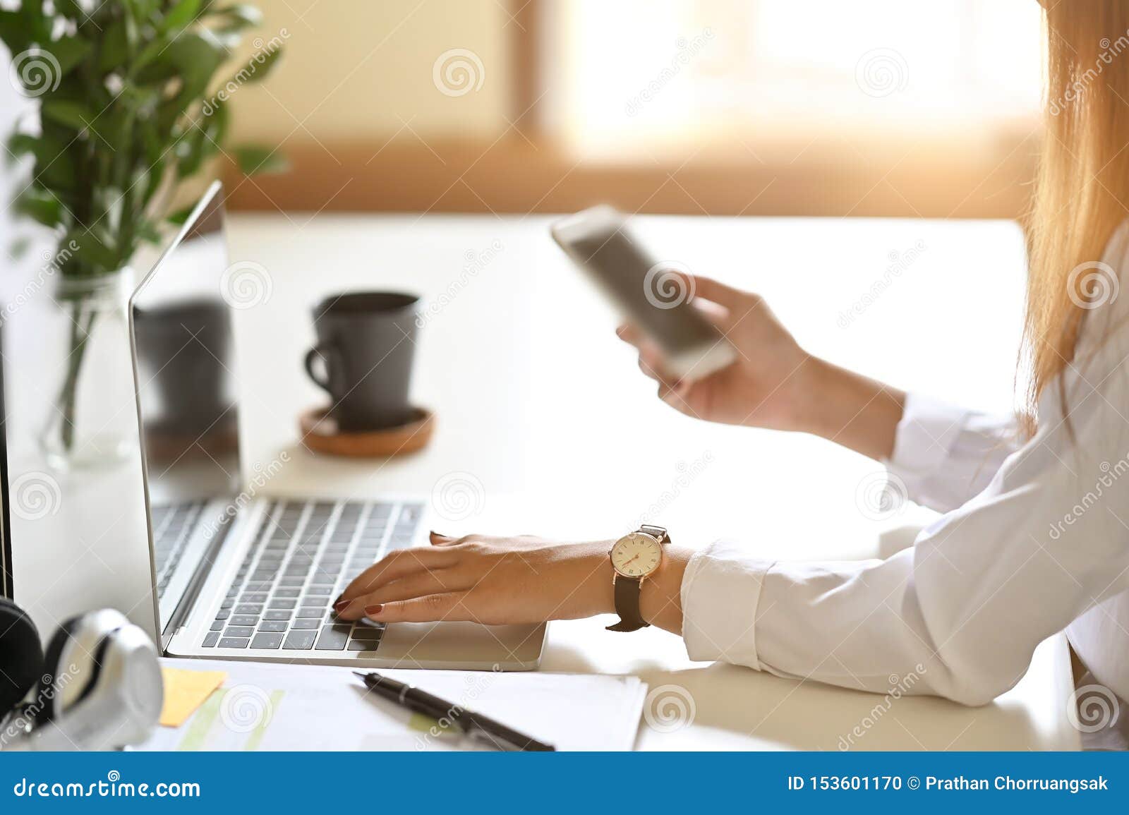 Women Using Laptop and Smartphone on Office Desk Stock Photo - Image of ...