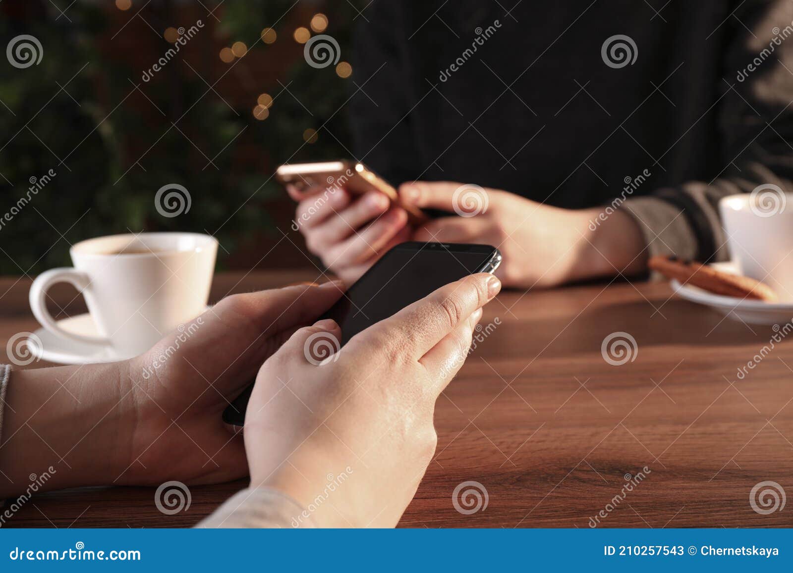 Women Using Mobile Phones at Table in Cafe, Closeup Stock Image - Image ...