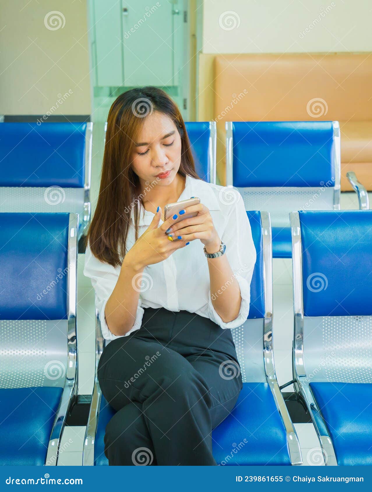 Women Using Mobile while Waiting for Queue in Hospital Stock Image ...