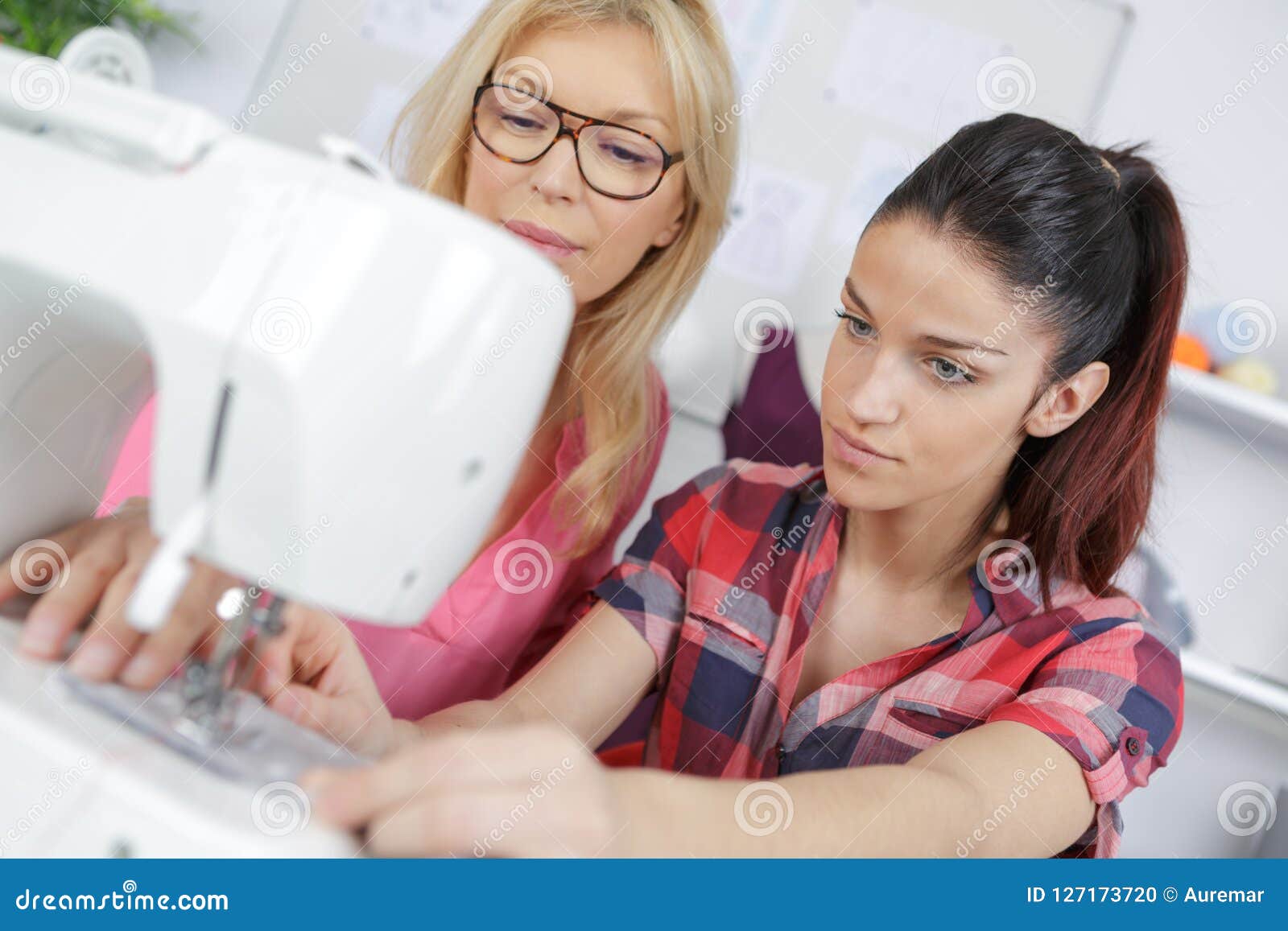 Women using sewing machine stock photo. Image of daughter - 127173720