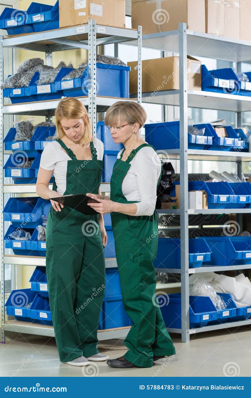 Women in the warehouse stock image. Image of factory - 57884783
