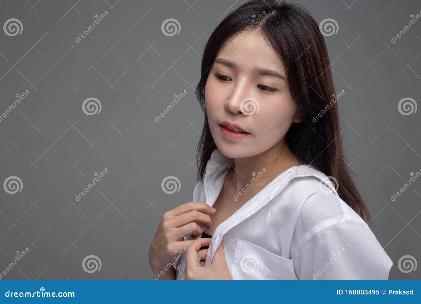Women Wear White Shirts and Look at the Bottom Stock Image - Image of ...