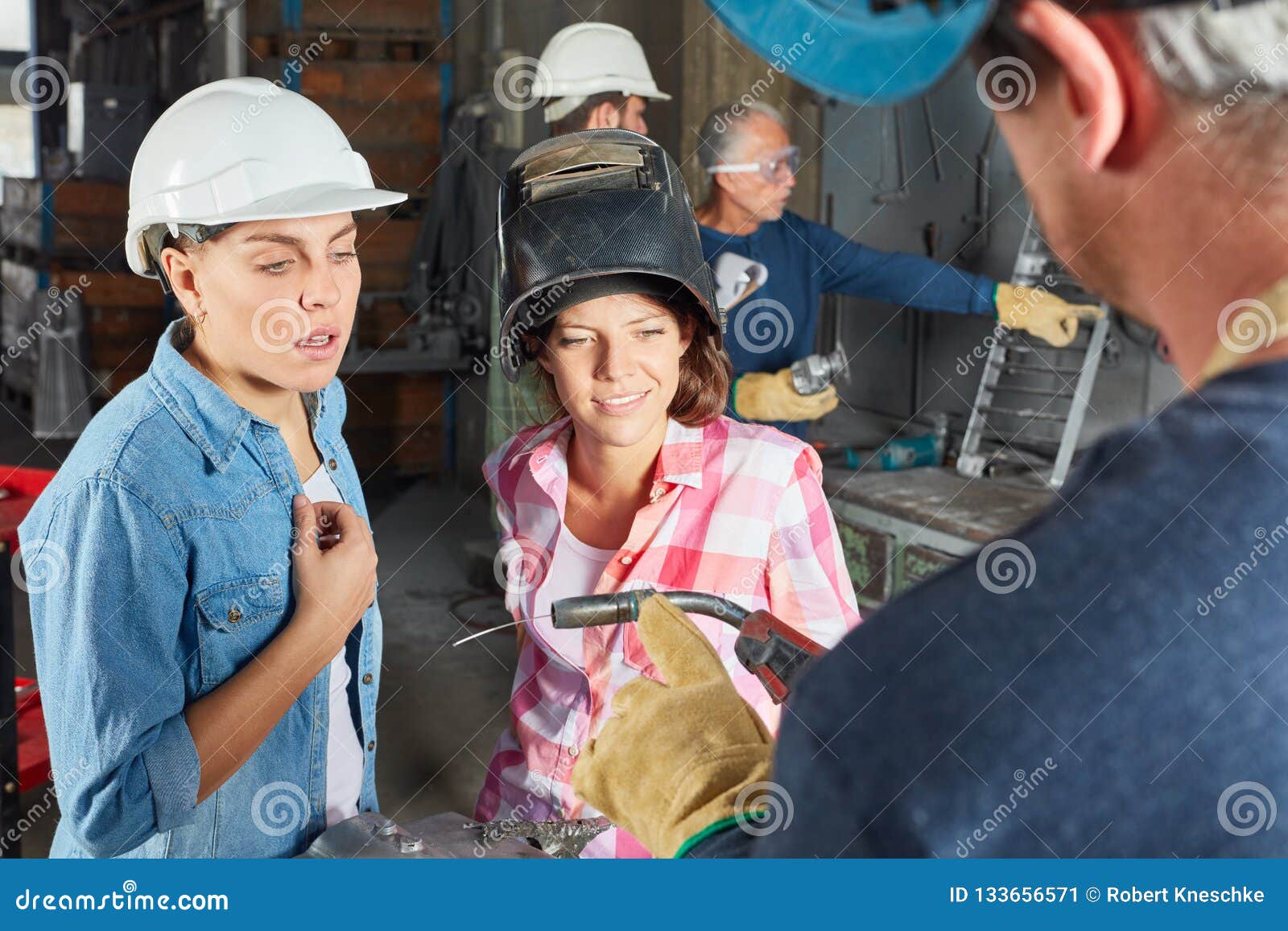 Women in welding lesson stock image. Image of industry - 133656571