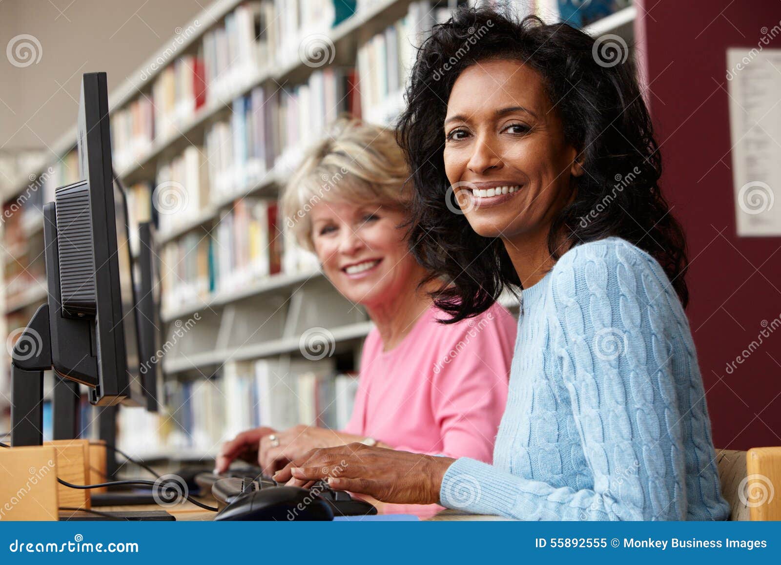 Women Working on Computers in Library Stock Image - Image of browsing ...