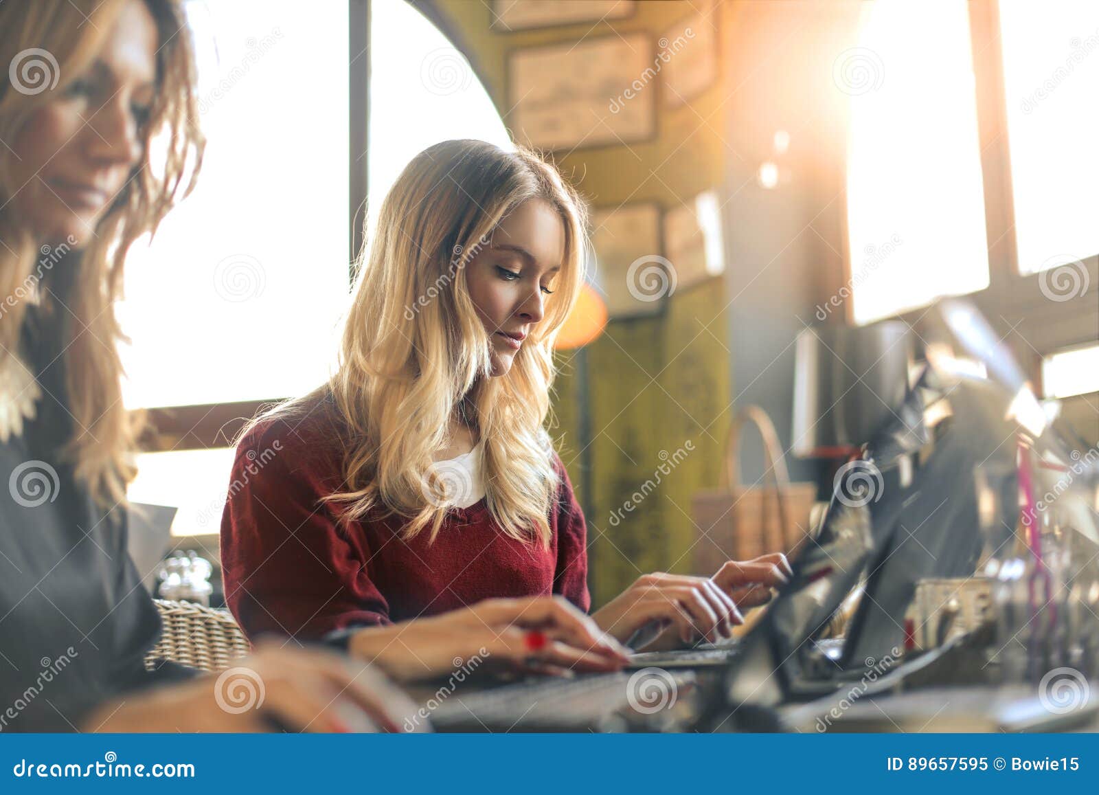 Two Women Are Working In A Data Center With Rows Of Server Racks Stock ...