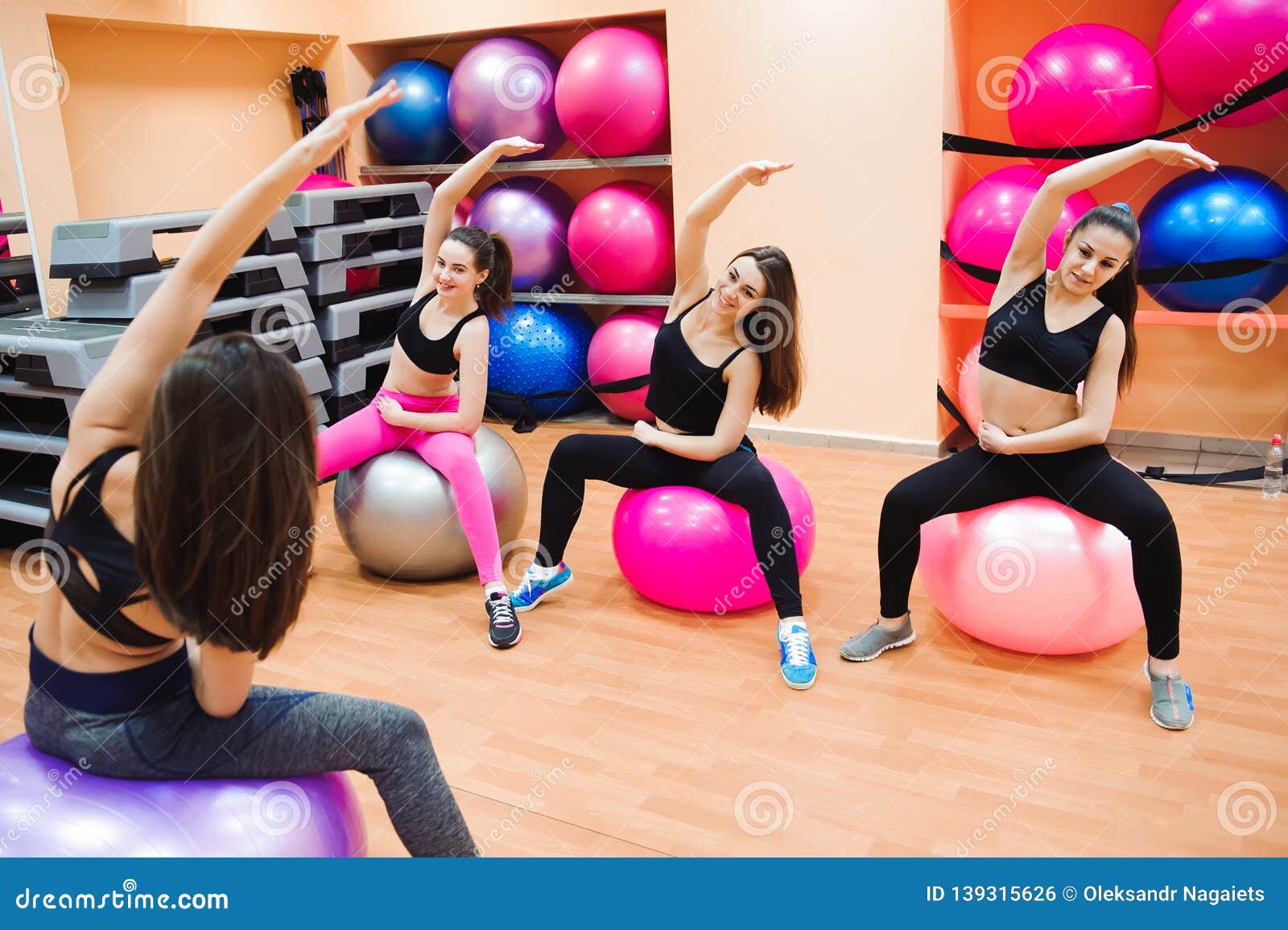 Women Working Out with Exercise Ball in Gym Stock Photo - Image of ball ...