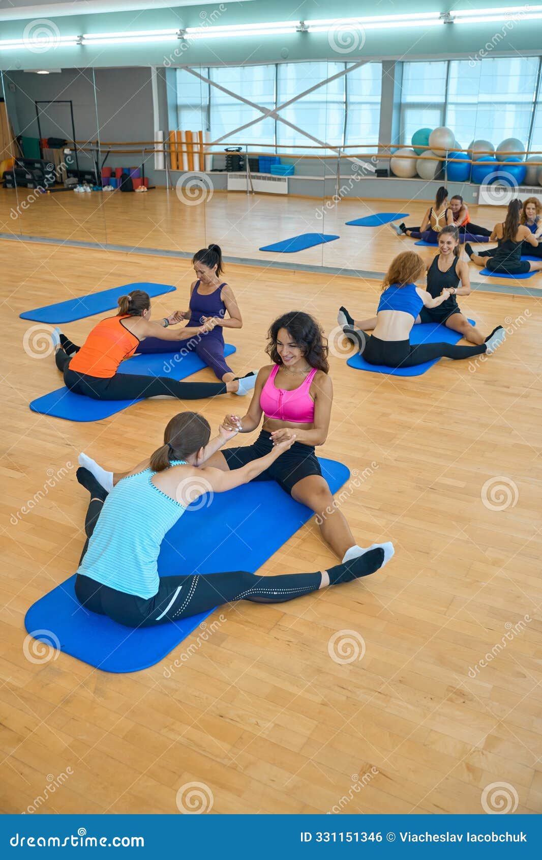 Womens Group Performs Stretching Exercises in Pairs Stock Photo - Image ...