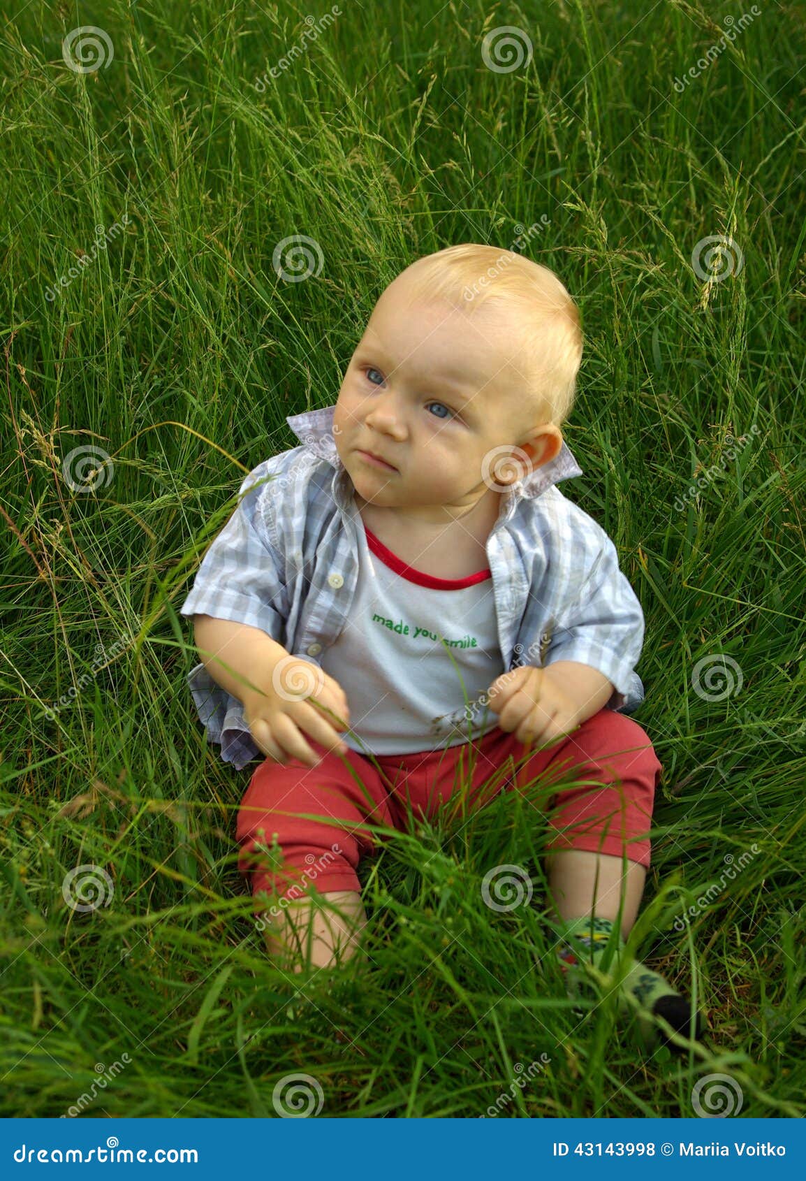 Wonderful Child Sitting on Green Grass Stock Photo - Image of equipment ...