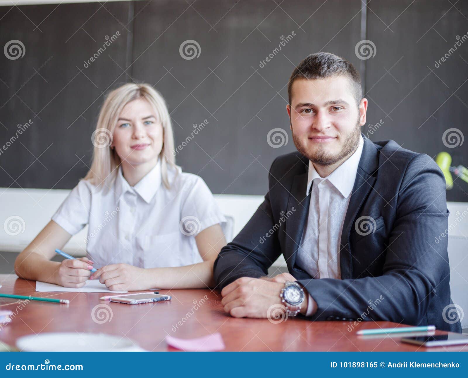 Wonderful Colleagues Sitting and Talking about Work. Pose on the Camera ...