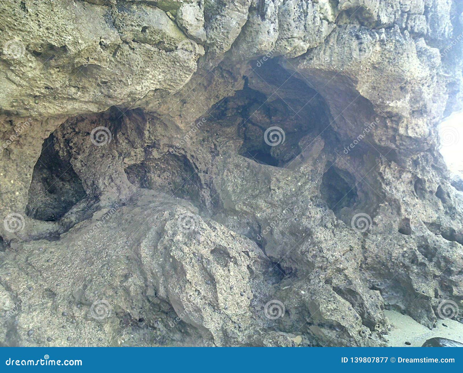 Holes in a Rock stock image. Image of rocj, wonderful - 139807877