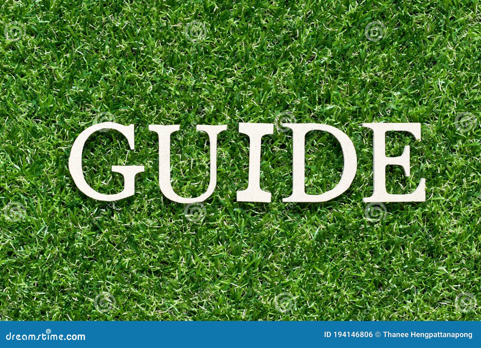 Wood Letter in Word Guide on Artificial Green Grass Background Stock ...