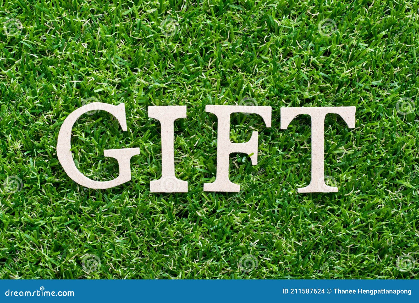 Wood Alphabet in Word Gift on Green Grass Background Stock Photo ...
