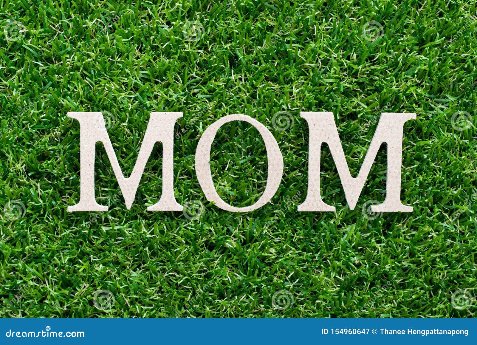 Wood Alphabet in Word Mom on Green Grass Background Stock Image - Image ...