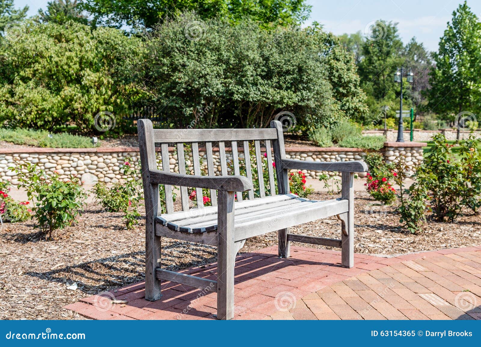 Wood Bench on Brick Walkway in Garden Stock Image - Image of green ...