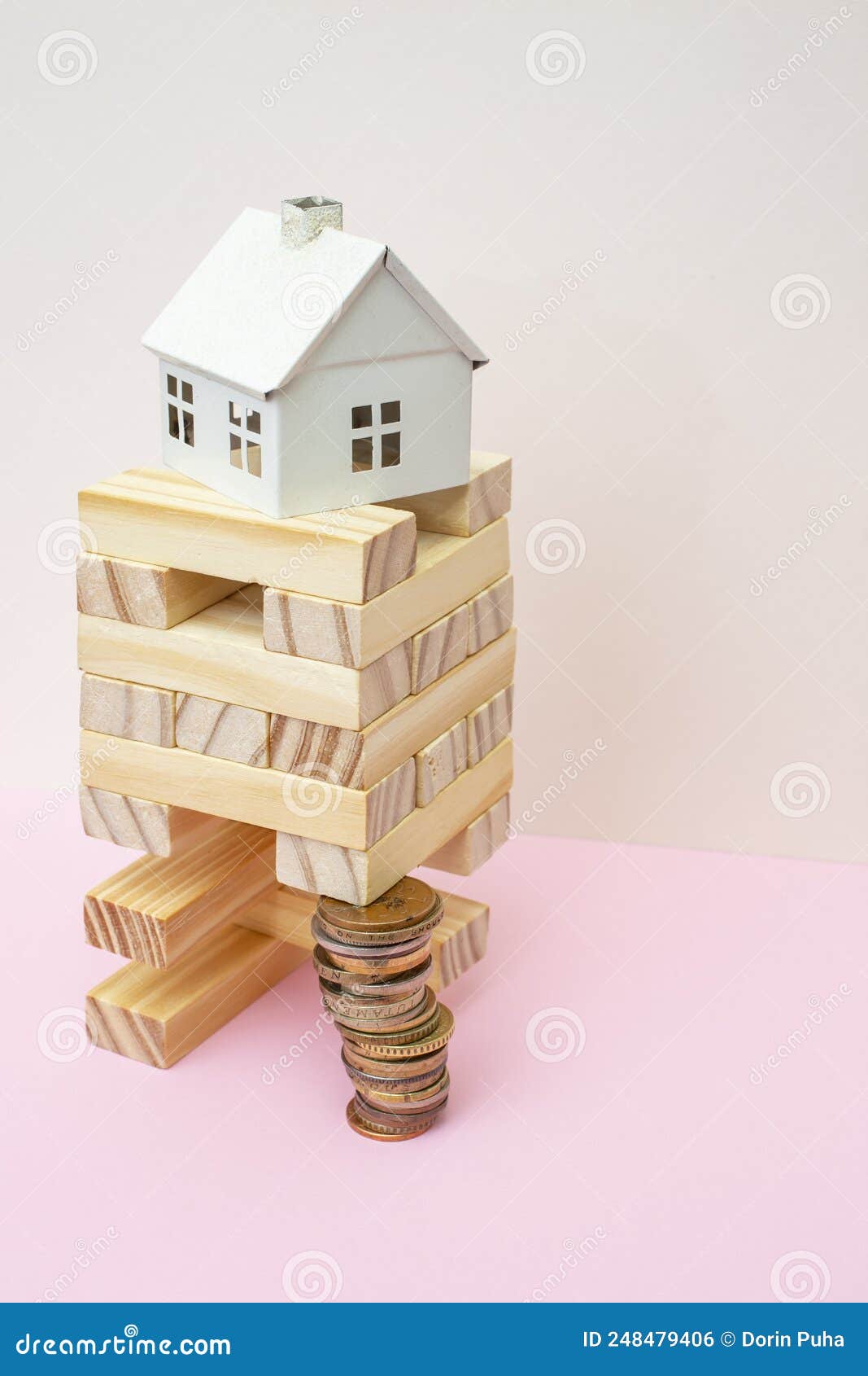 Wood Blocks Tower Supported by a Stack of Coins. Stock Photo - Image of ...