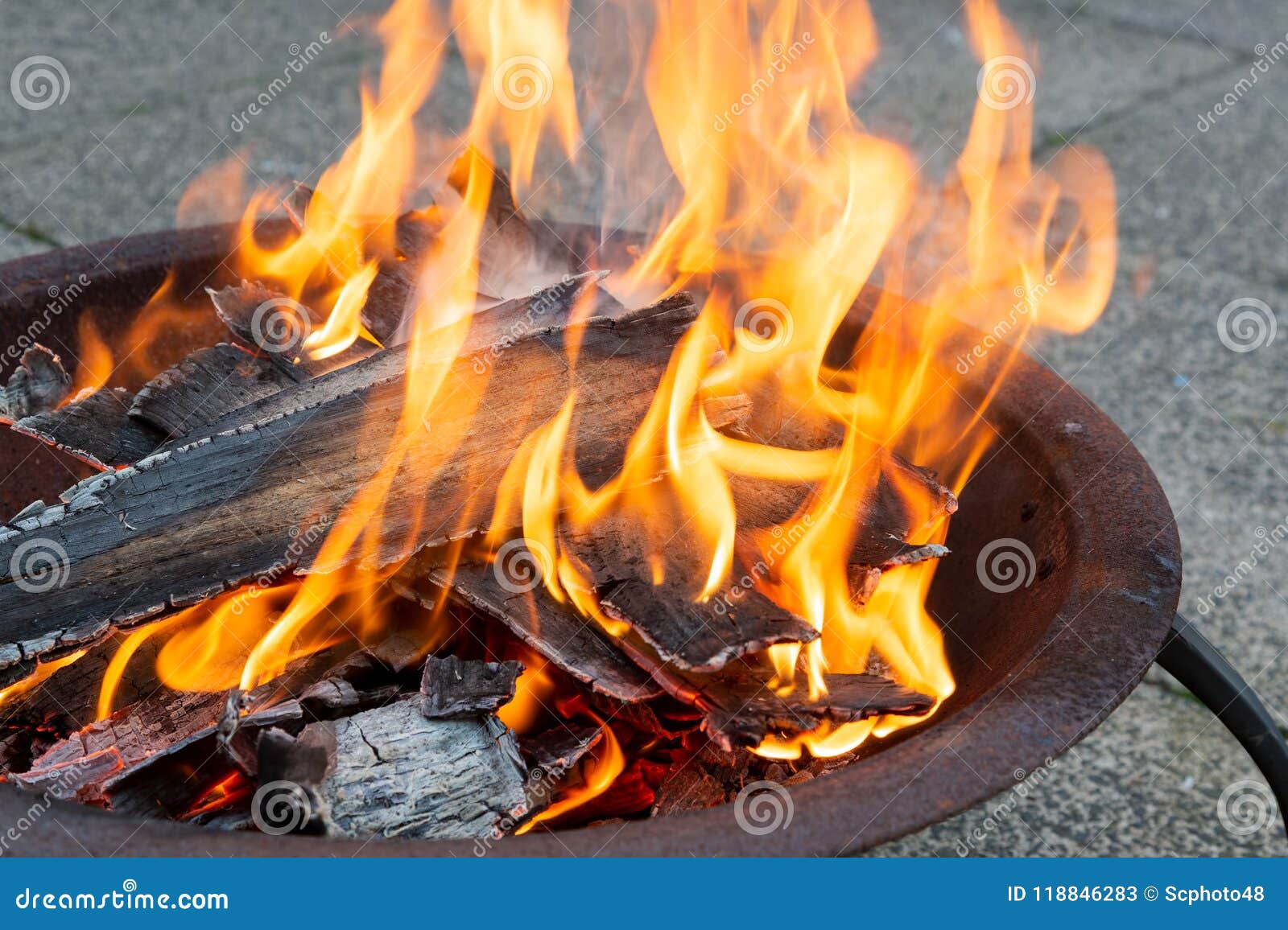 Wood Burning in a Metal Fire Pit Stock Image - Image of outdoor, flame ...