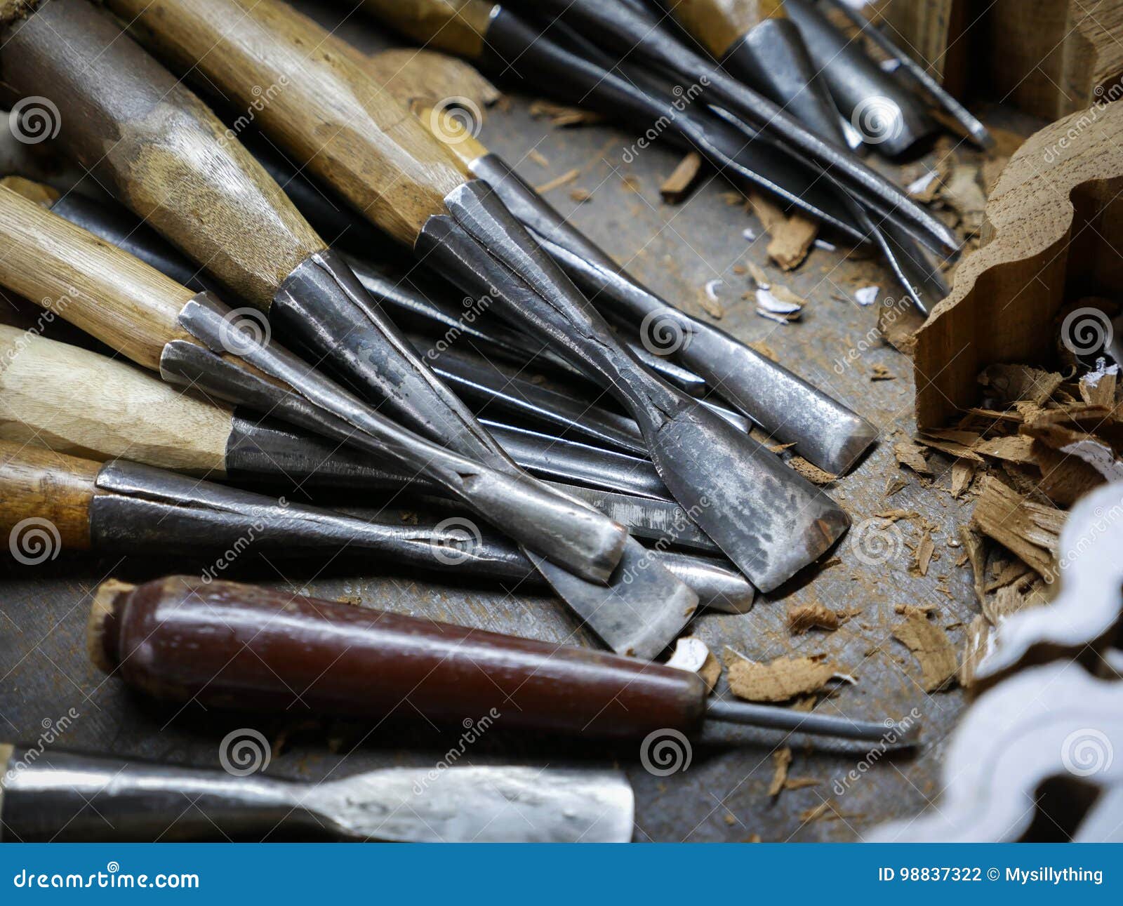 Set Of Carving Tools With Chisels And Hammer On Top Of Wooden Workbench ...