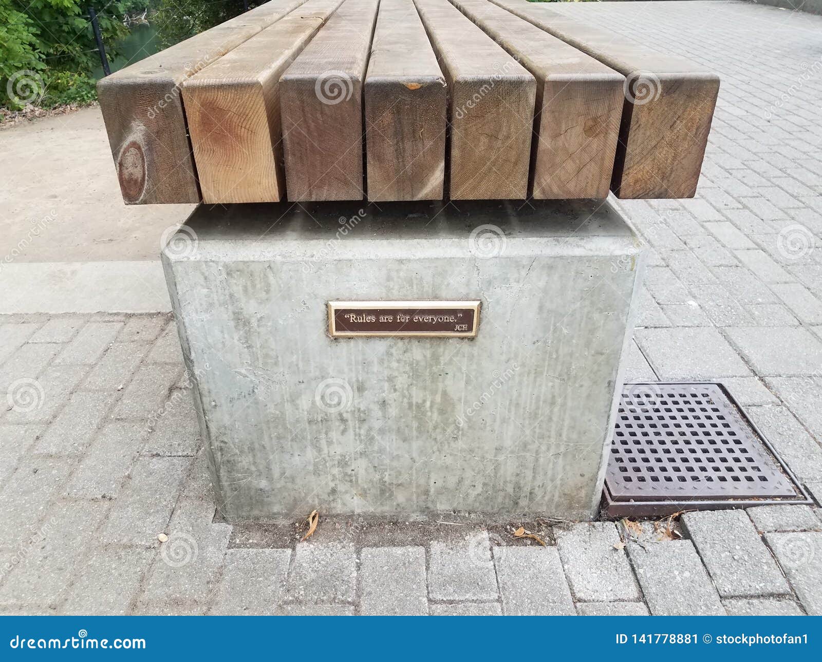 Wood and Cement Bench with Rules are for Everyone Sign Stock Image ...