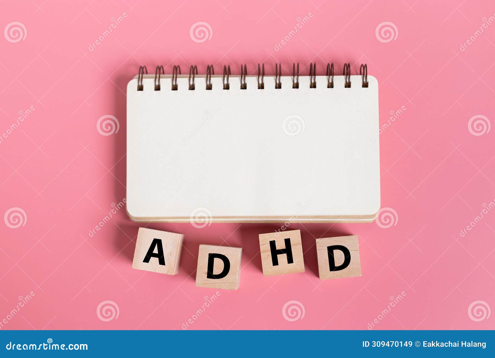 Wood Cube Block Abbreviation of ADHD with Note Book on Pink Table ...