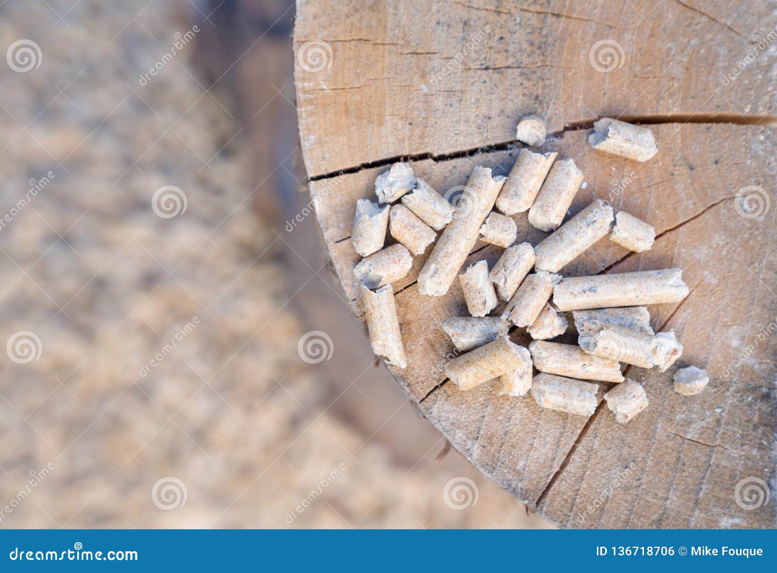 Wood Pellets on a Log of Wood with a Blurred Background Stock Photo ...