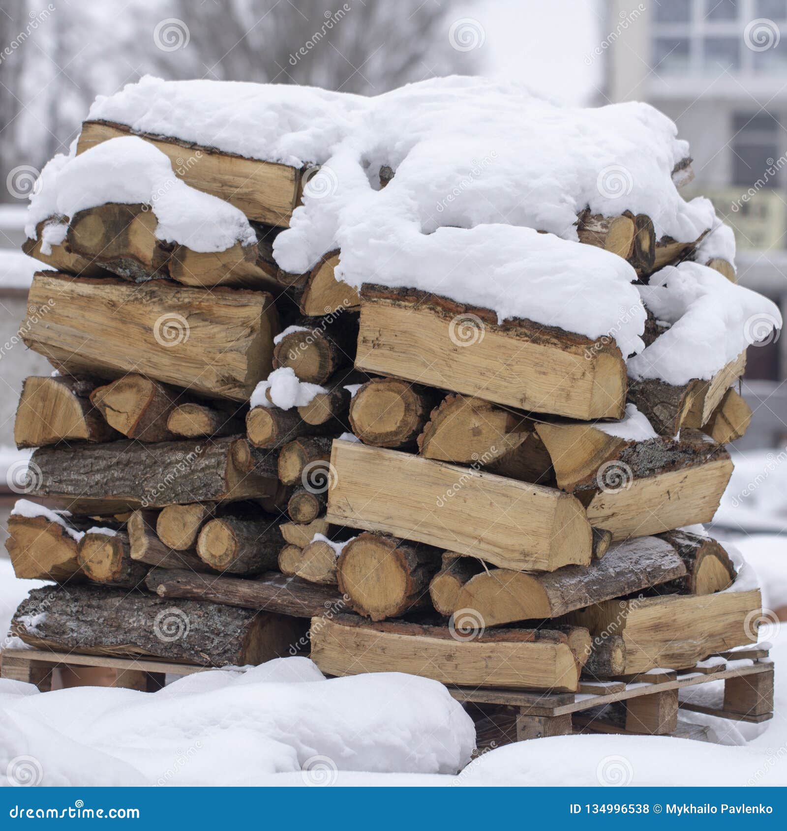 Wood Pile Stack of Firewood Under the Snow. Stack of Cut Wood Under the ...