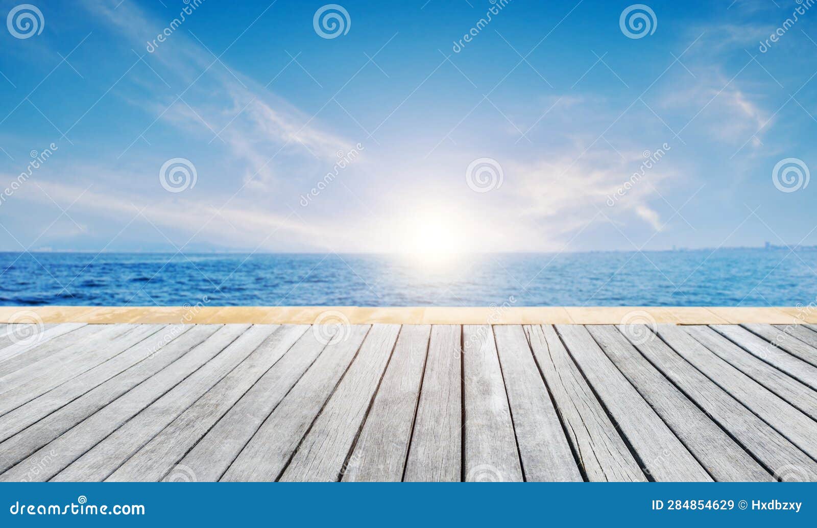 A Wood Platform With Railing And Benches Overlooking A Field Of ...