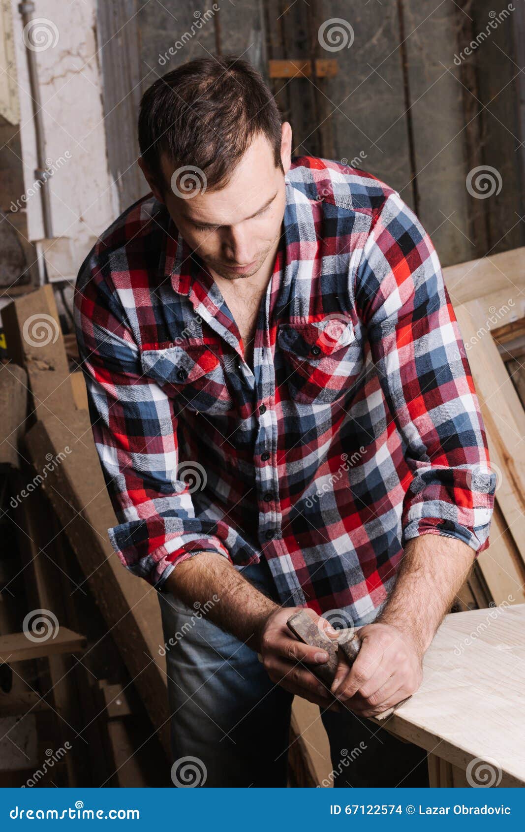 Wood Processing. Confident Young Male Carpenter Working with Wood Stock ...
