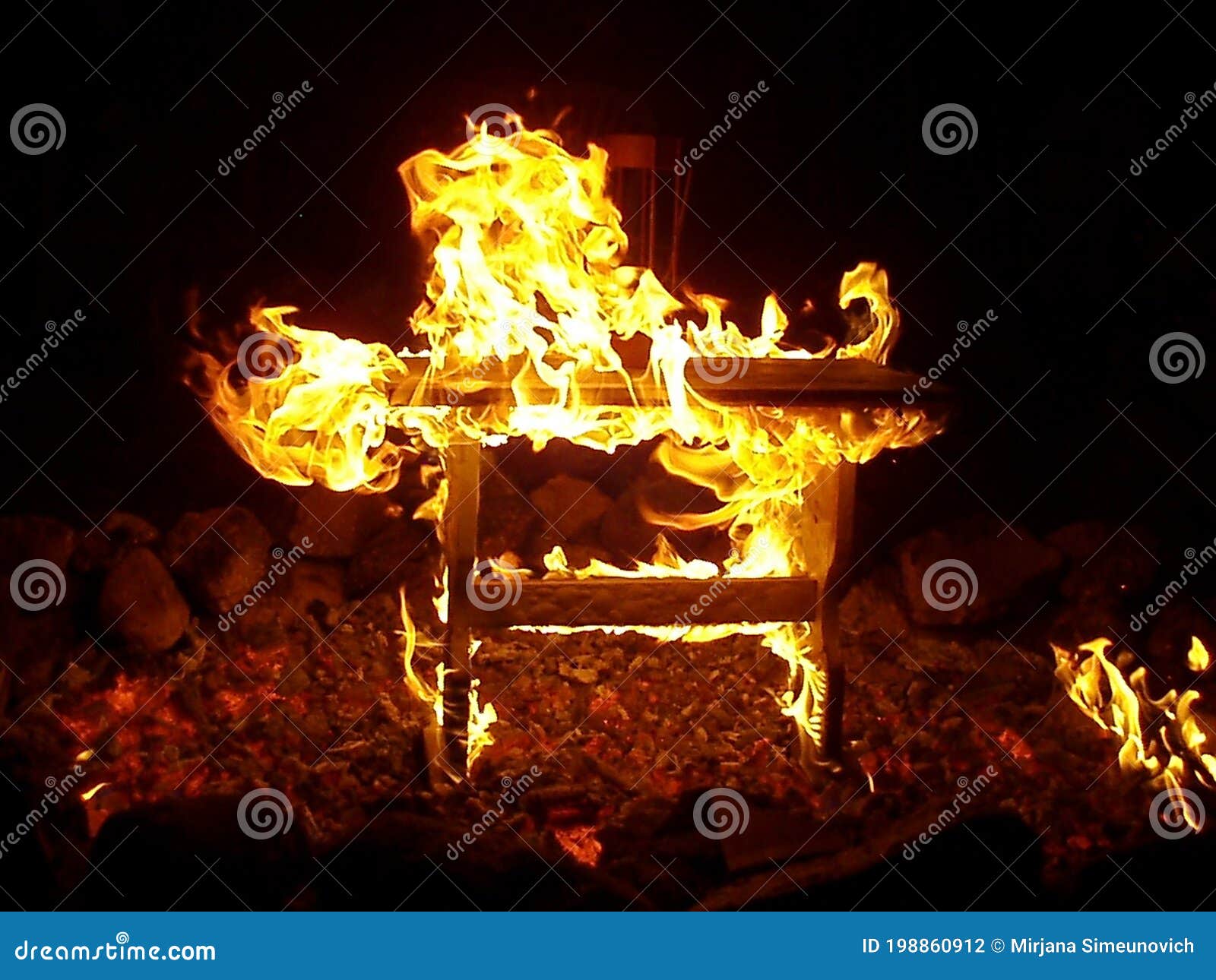 Wood Sculpture in fire stock photo. Image of flame, canada - 198860912