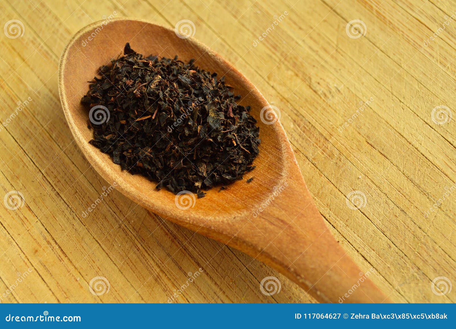 Wood spoon and black tea stock image. Image of ladle - 117064627