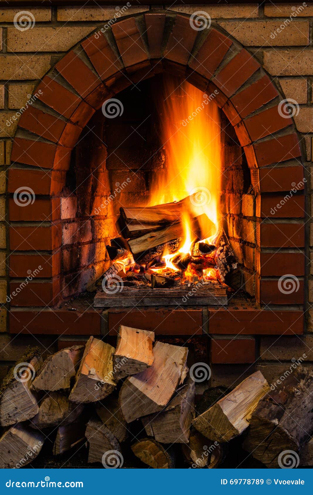 Wood Stack and Logs Burning in Brick Fireplace Stock Image - Image of ...