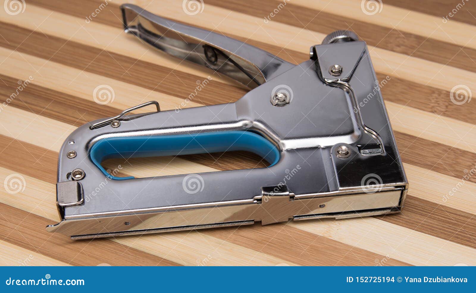 Wood Stapler Lying on a Board Stock Photo - Image of background ...