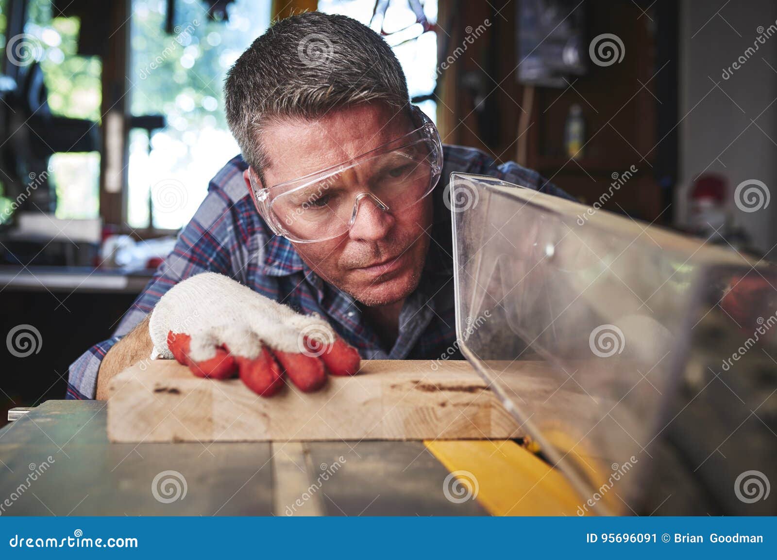 Wood worker stock image. Image of machinery, male, plaid - 95696091