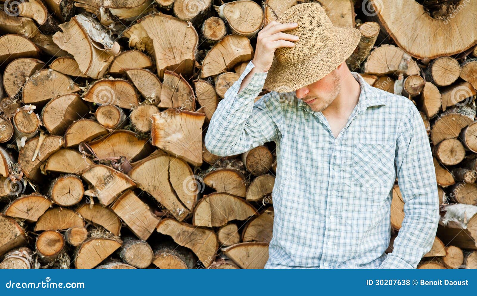 Woodcutter with Straw Hat on a Background of Wood Stock Photo - Image ...