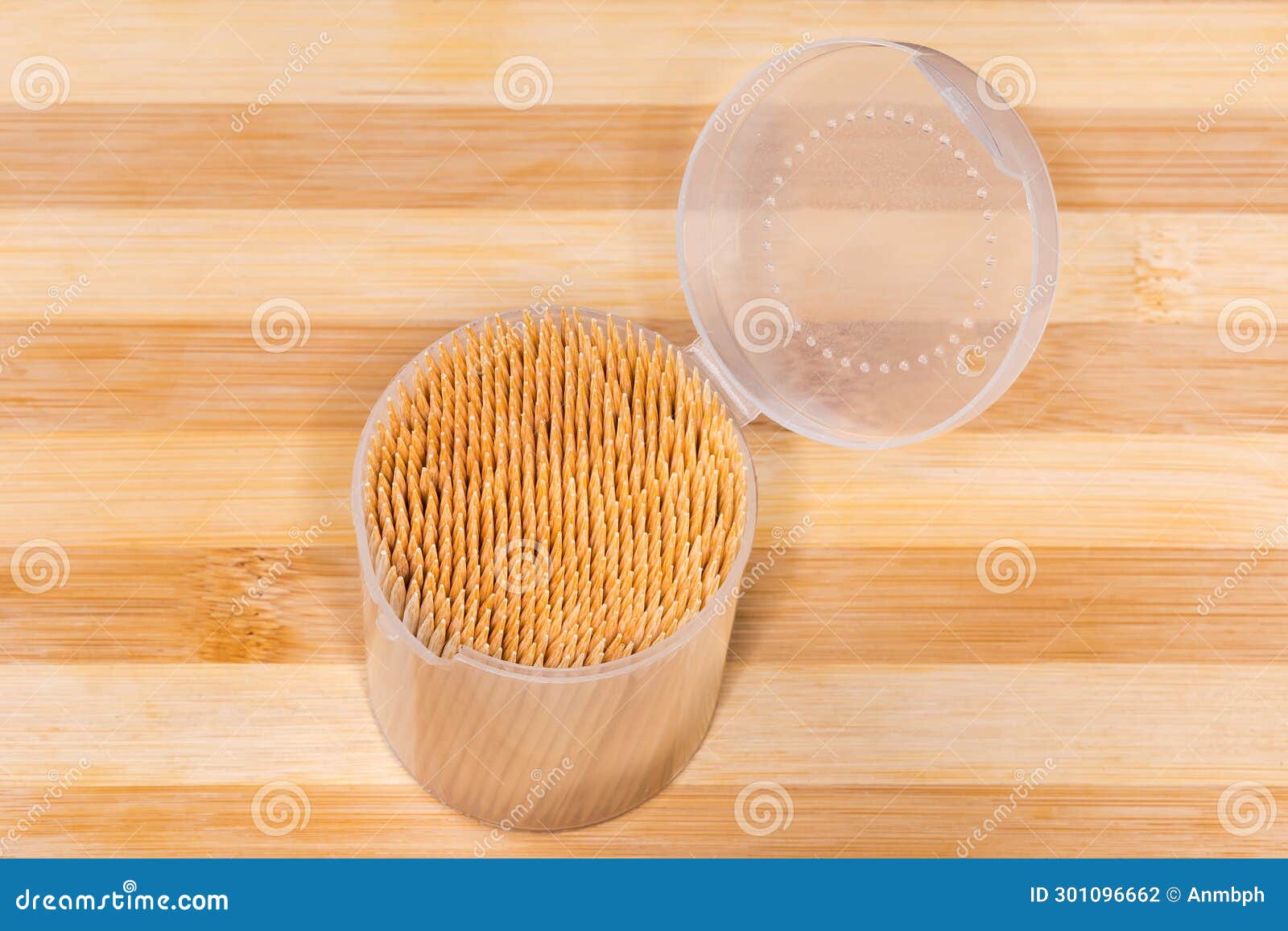 Wooden Bamboo Toothpicks in Open Plastic Container on Wooden Surface ...