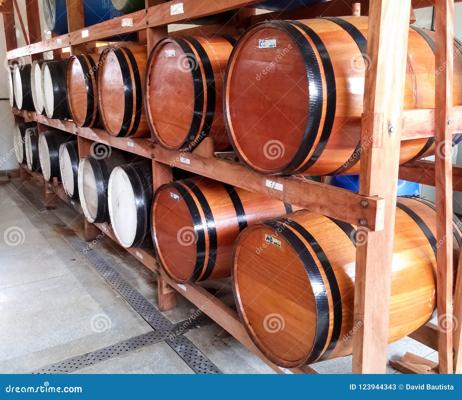 Wooden Barrels for Storage of Alcoholic Beverages Grouped in a Cellar ...