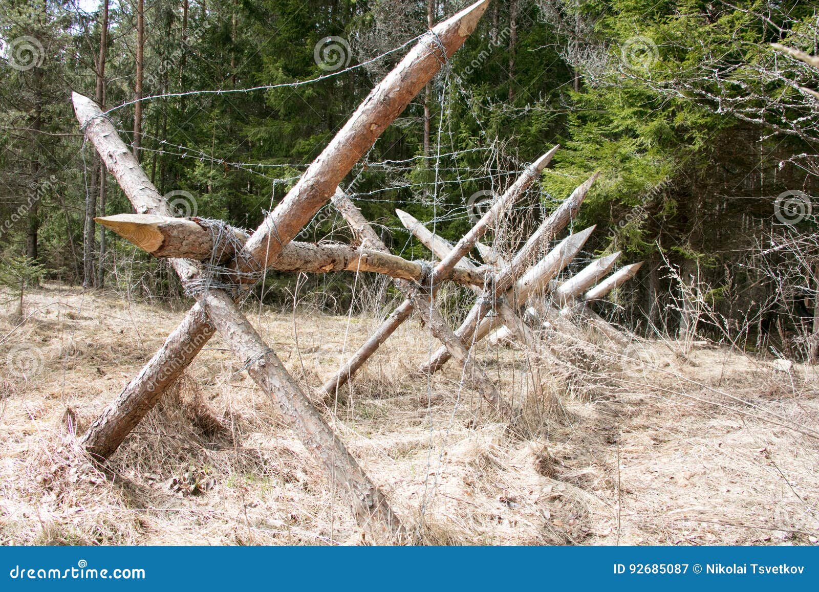 Wooden Barricade with a Barbed Wire Stock Image - Image of column, wood ...