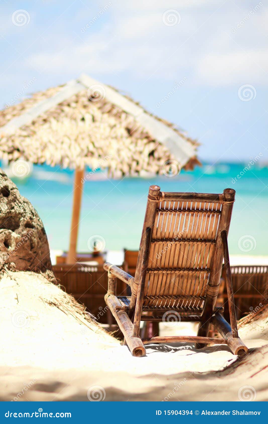 Wooden Beach Chair on Exotic Beach Stock Photo - Image of vertical ...
