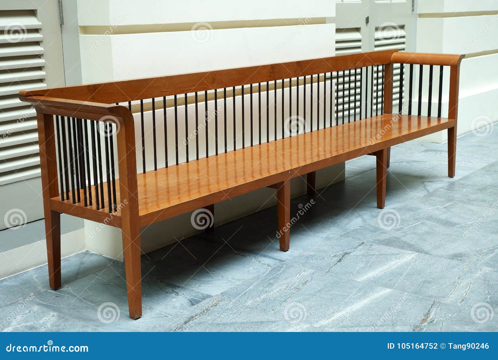 Wooden Bench in Front of a Wall Stock Photo - Image of park, rest ...