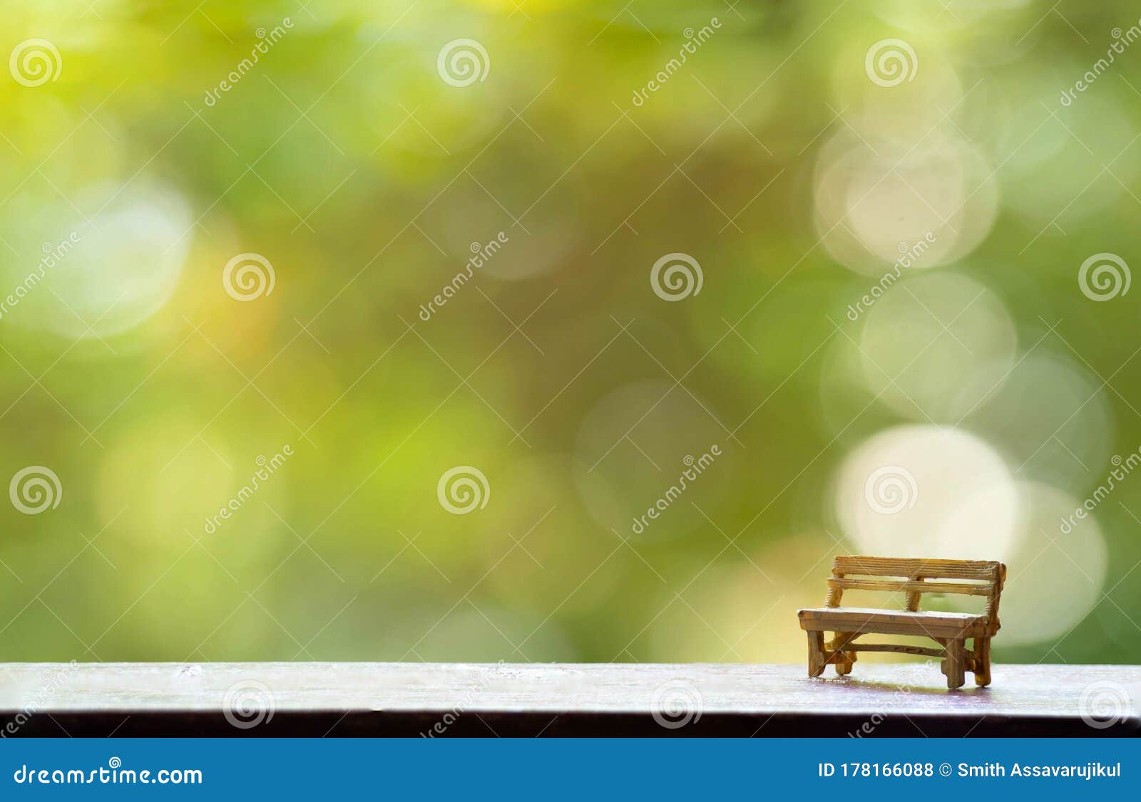 The Wooden Bench with Green Tree Bokeh in the Background for Wallpaper ...