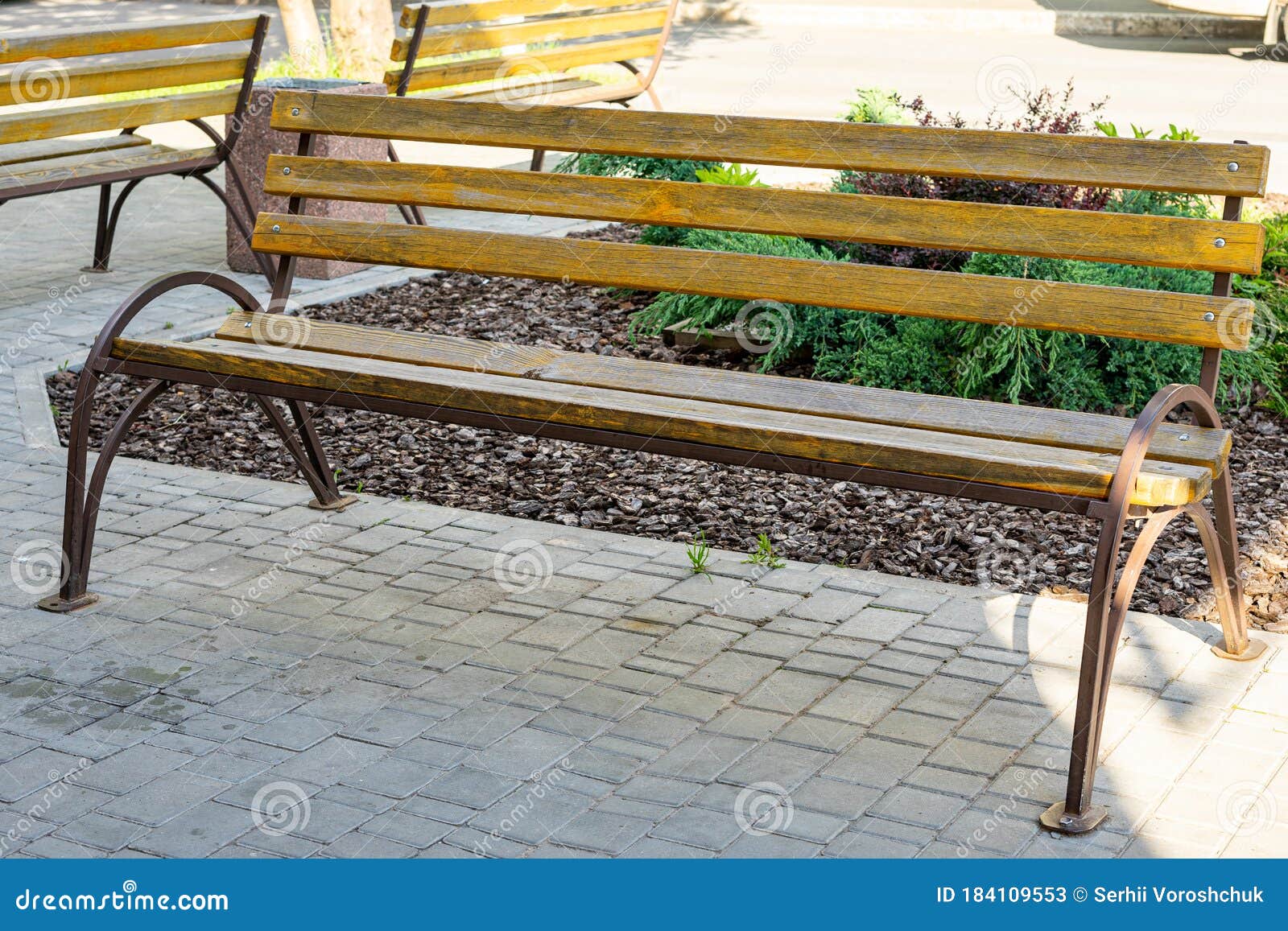 Wooden Bench with a Metal Frame in the City Stock Image - Image of ...
