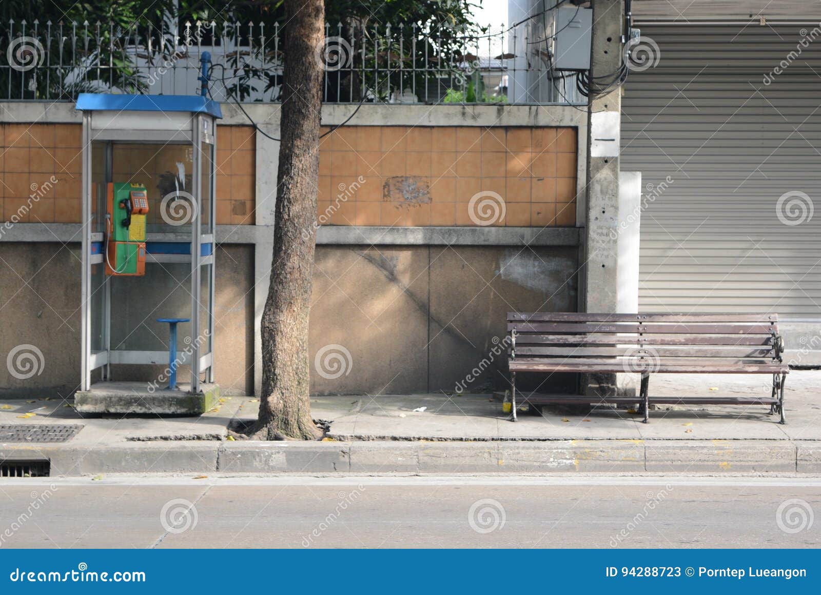 Wooden Bench and Pay Phone Stand Stock Image - Image of bench, grass ...