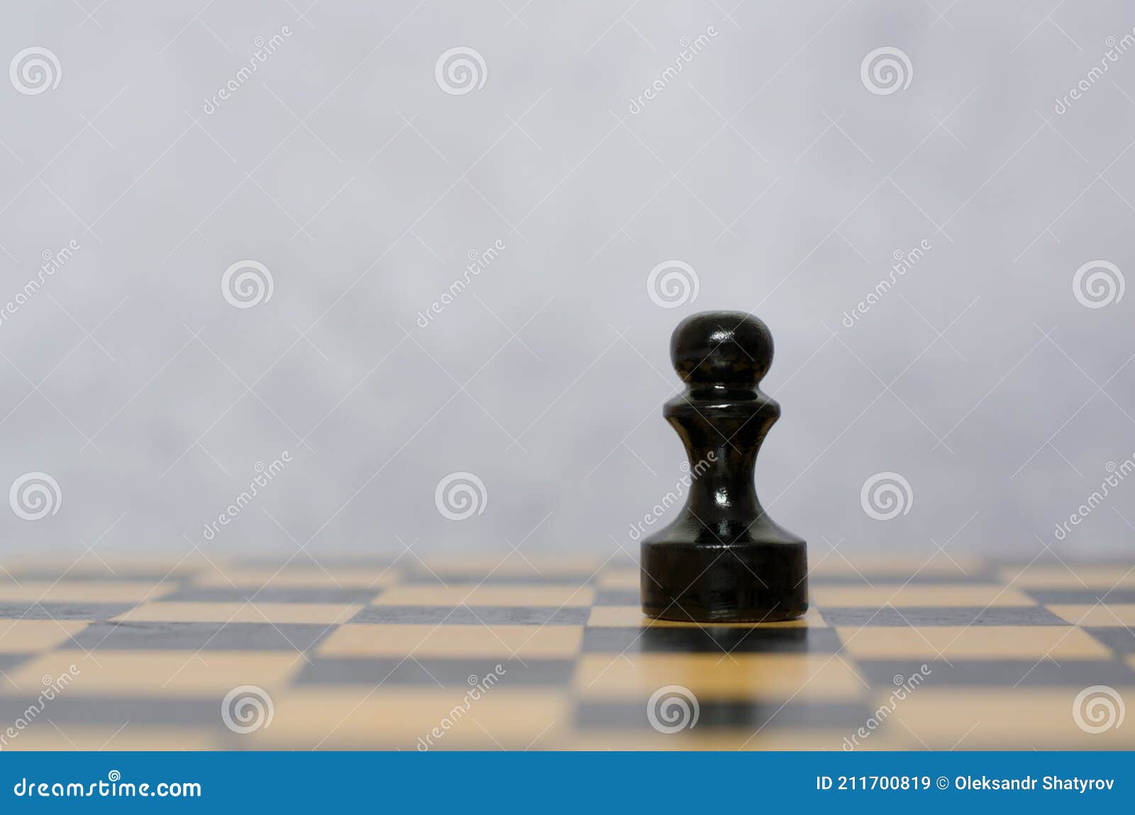 Wooden Black Pawn on a Chessboard Stock Image - Image of conceptual ...