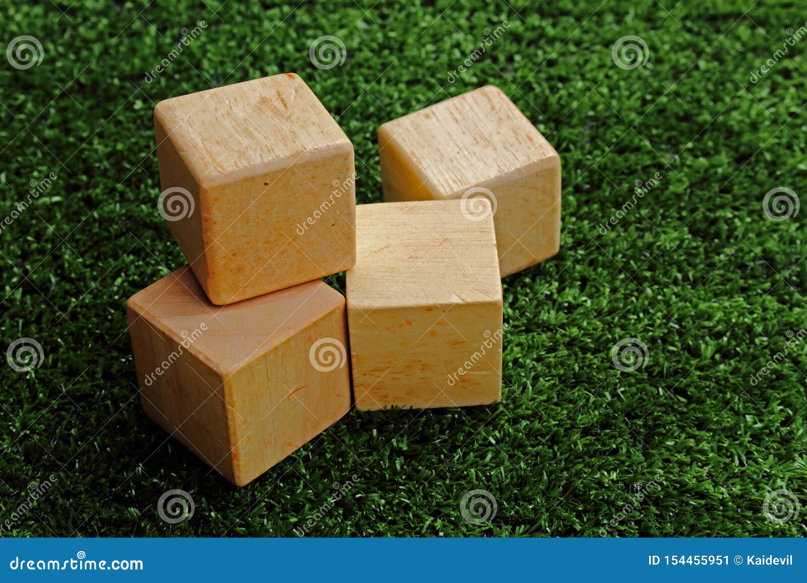 Wooden block on turf stock image. Image of hardwood - 154455951