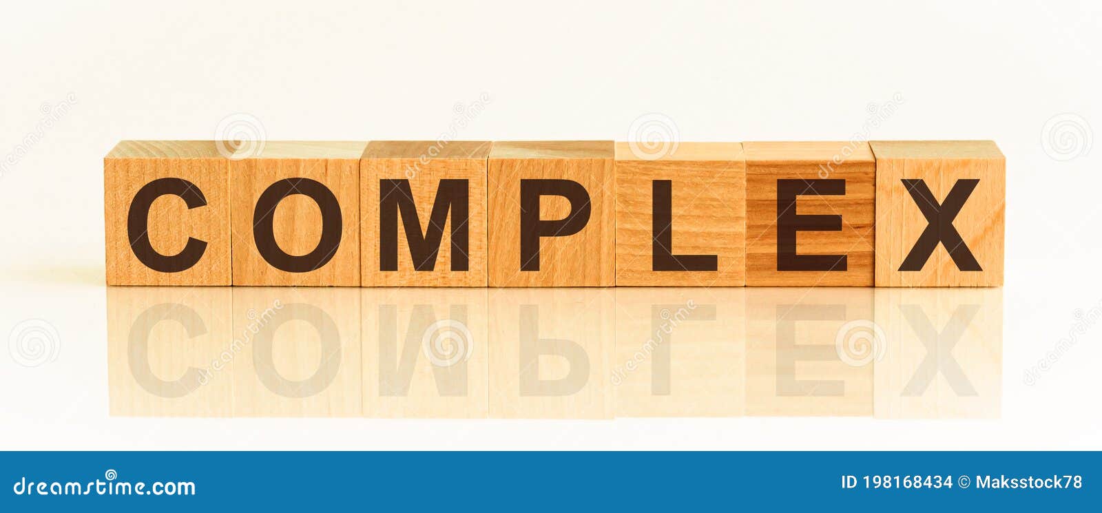 Wooden Blocks with the Text: Complex. the Text is Written in Black ...
