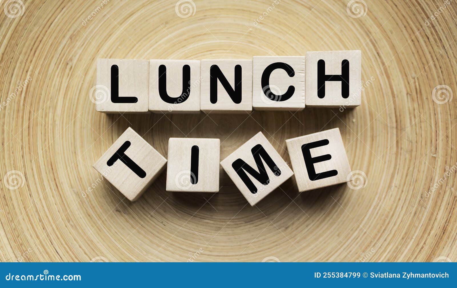 Wooden Blocks with the Text LUNCH TIME on a Wooden Plate Stock Image ...